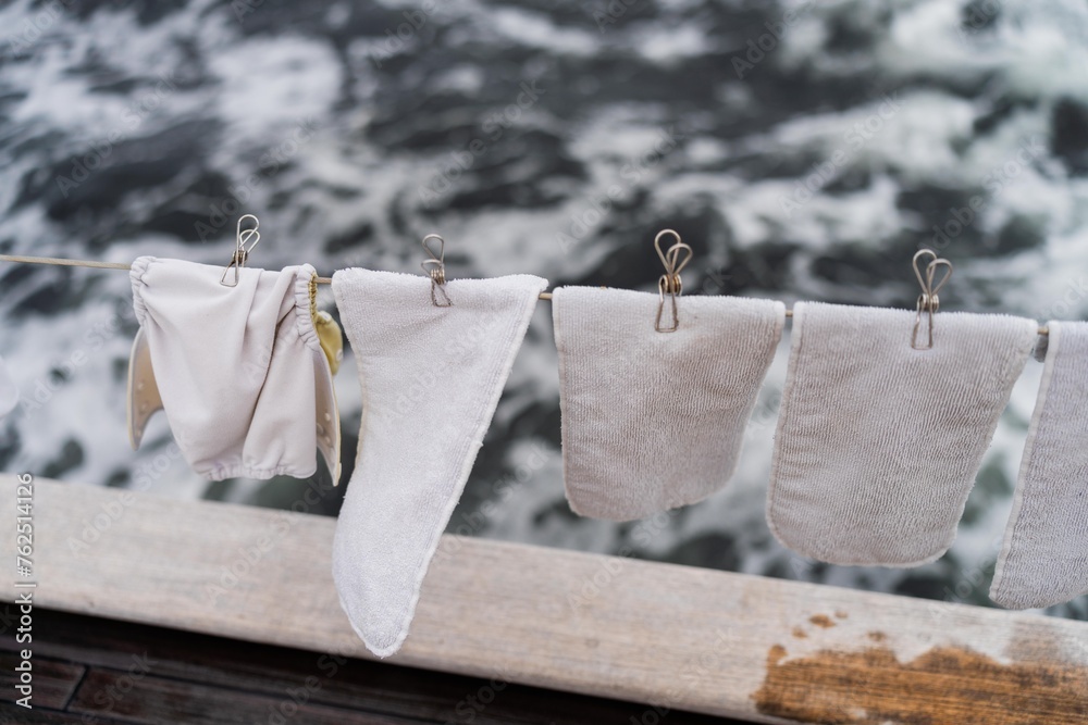 clothes drying on a washing line on a yacht boat traveling over the ...