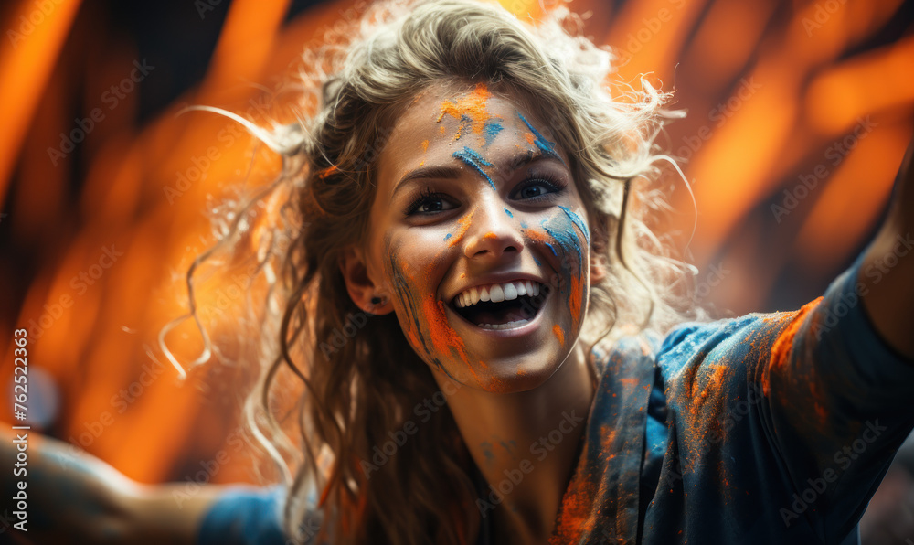 Portrait of a passionate female Dutch fan celebrating at a UEFA EURO ...