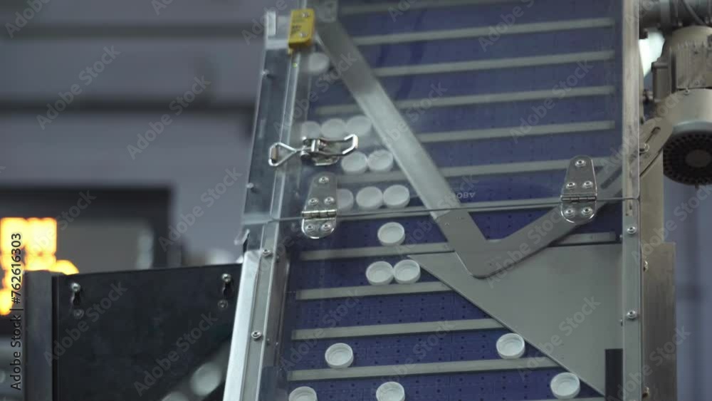 Machine Pushing Plastic Cups Into Groove At Conveyor Line On ...