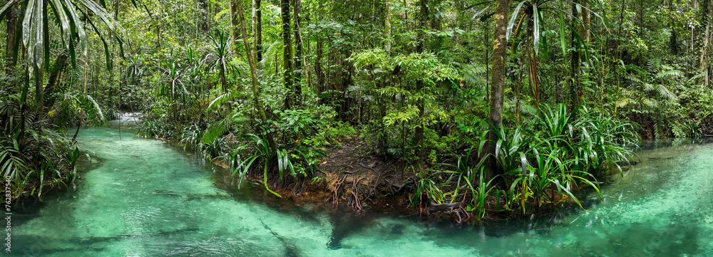 Kali Biru, a turquoise river flowing through an Indonesian Rainforest ...