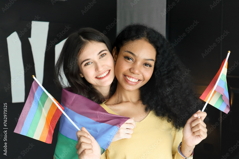 Two ethnically diverse lesbians smiling proudly about their ...
