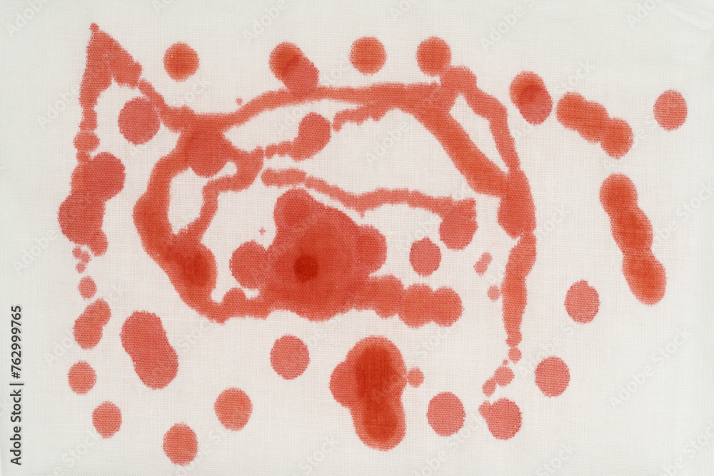 Drops of blood stains on white fabric. blood splatters on clothes. red ...