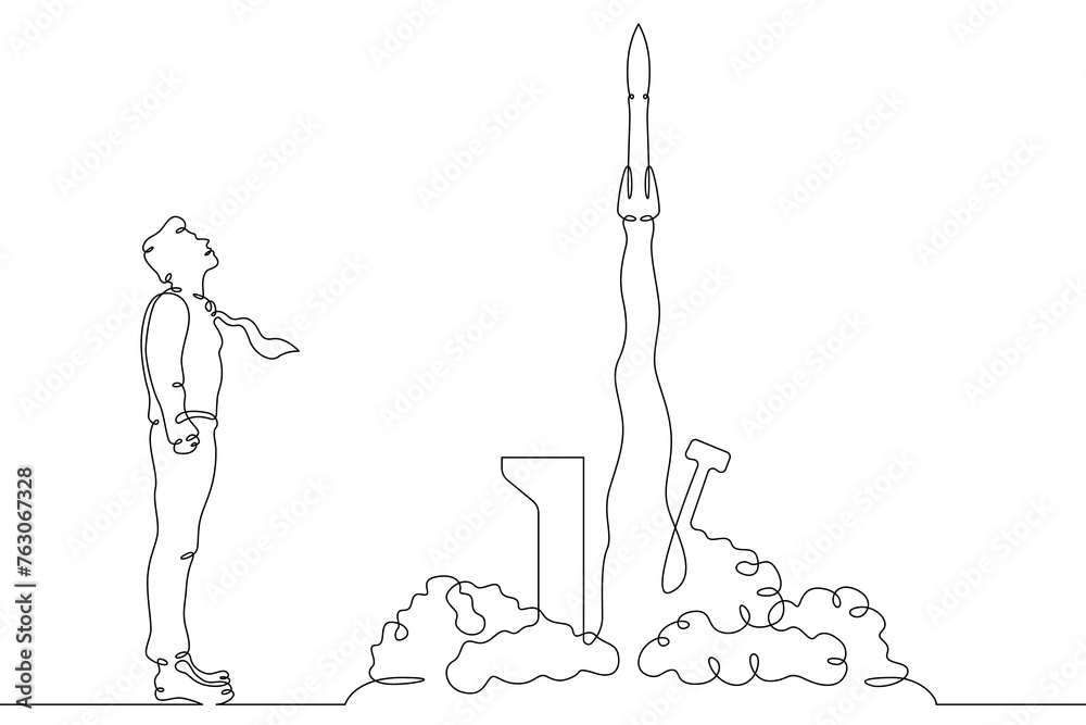 Spaceship launch. The constructor man watches the rocket take off ...