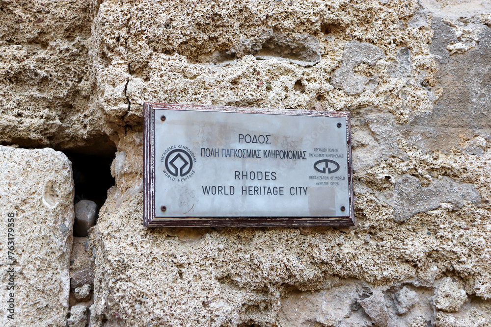 Rhodes, Greece- April 11, 2023: Rhodes World Heritage City sign hung at ...