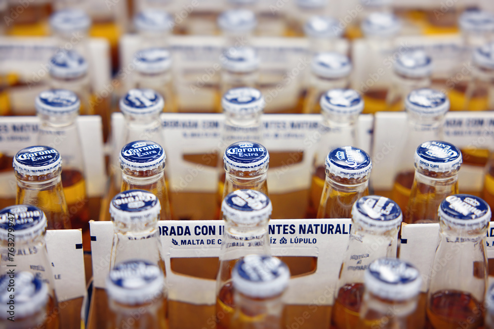 Corona Extra Beer sale, in beer boxes for 6 bottles, with handle. Pile ...