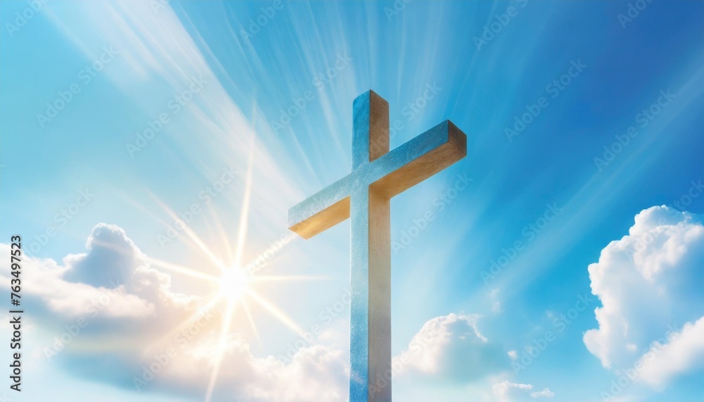 christian cross appears bright in blue sky background with sunny light ...