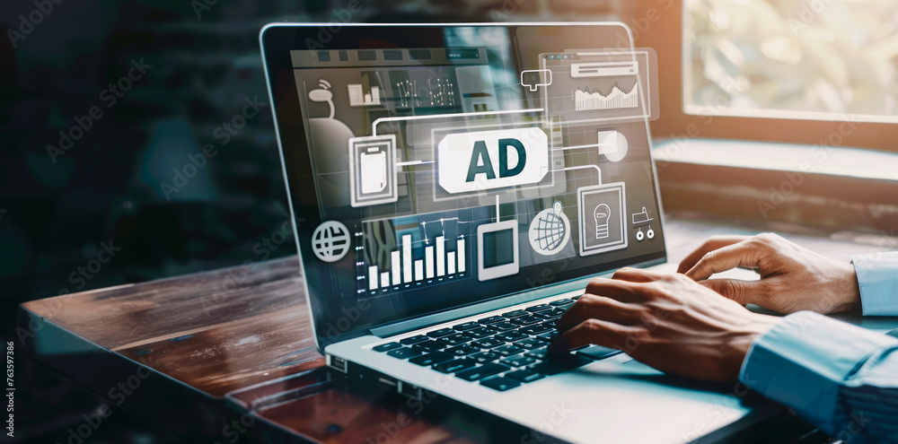 Person typing on laptop, ad icon floating above keyboard displaying ...