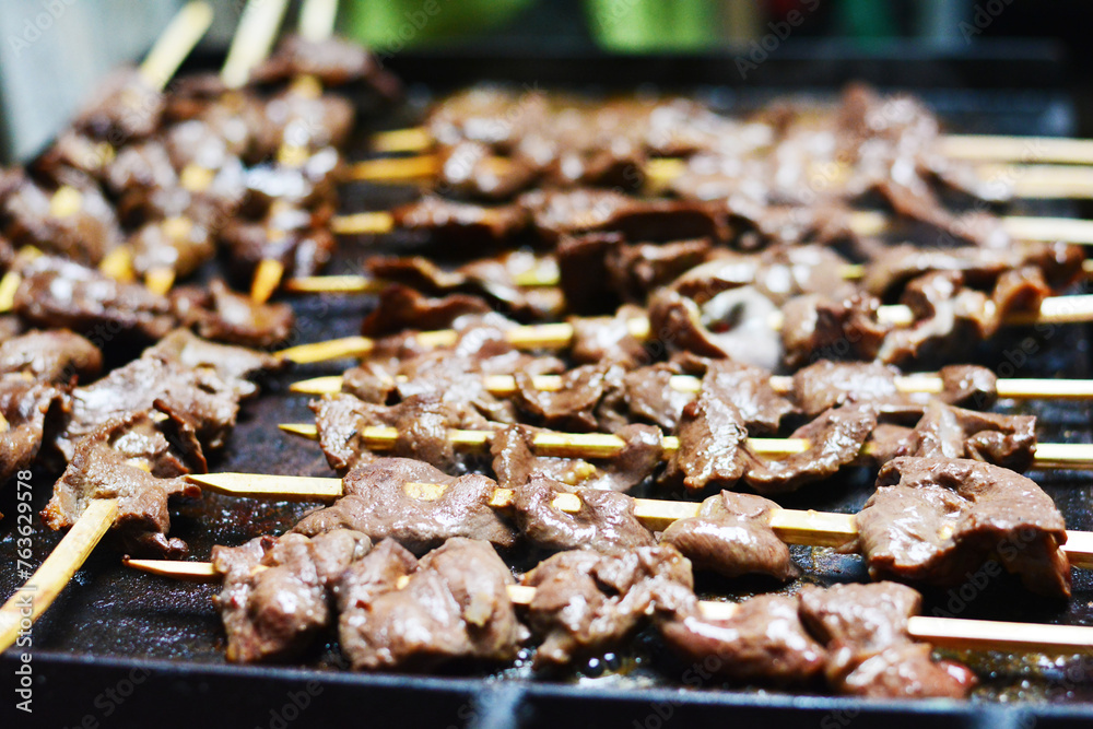 Cooking typical peruvian food anticuchos.Cooking typical peruvian food ...