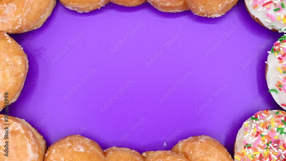 4K HD video zooming out on various frosted and glazed donuts, white ...