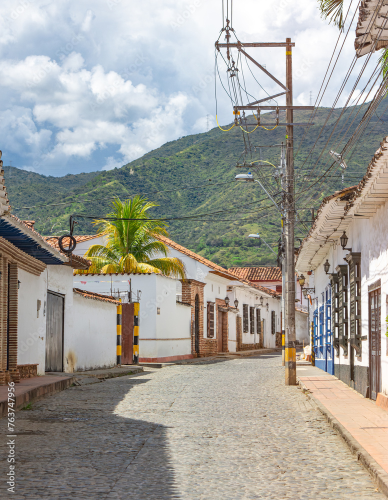 Colonial architecture on a cobblestone street in Santa Fe de Antioquia ...