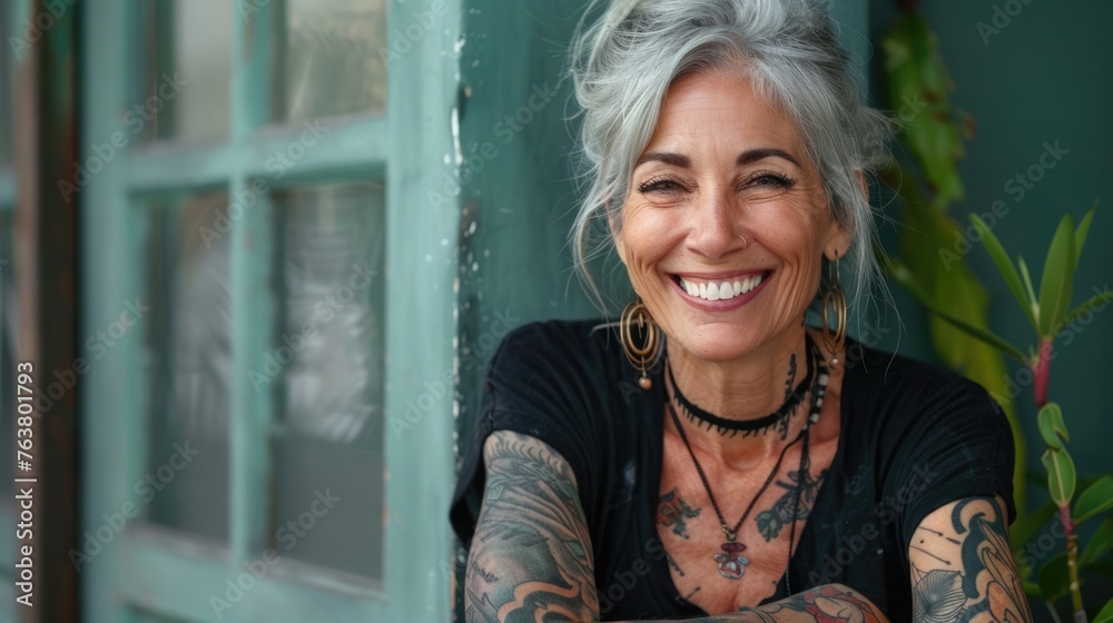 Beautiful retired pensioner woman with gray hair. Tattooed fashionable ...
