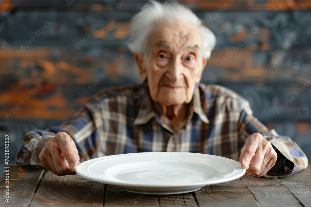 Old person in front of an empty plate , elders poverty and ...