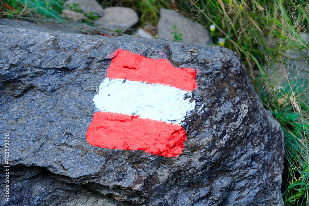red, white marks on stone, waypoint on route, trail marker, Navigating ...