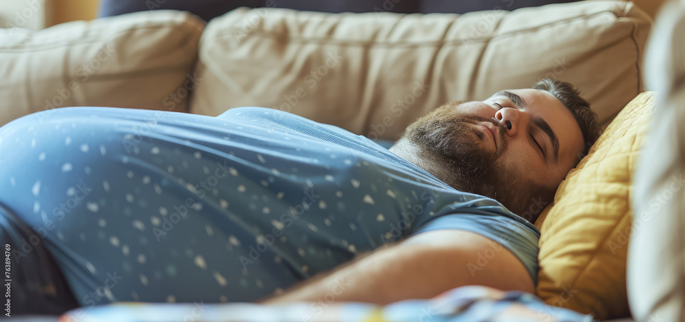 Fat lazy adult Man Relaxing on Couch at Home. An unshaven, overweight ...