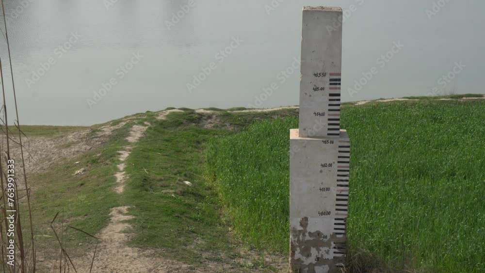 Rising water level measure sign board in a lake in the Punjab Pakistan ...