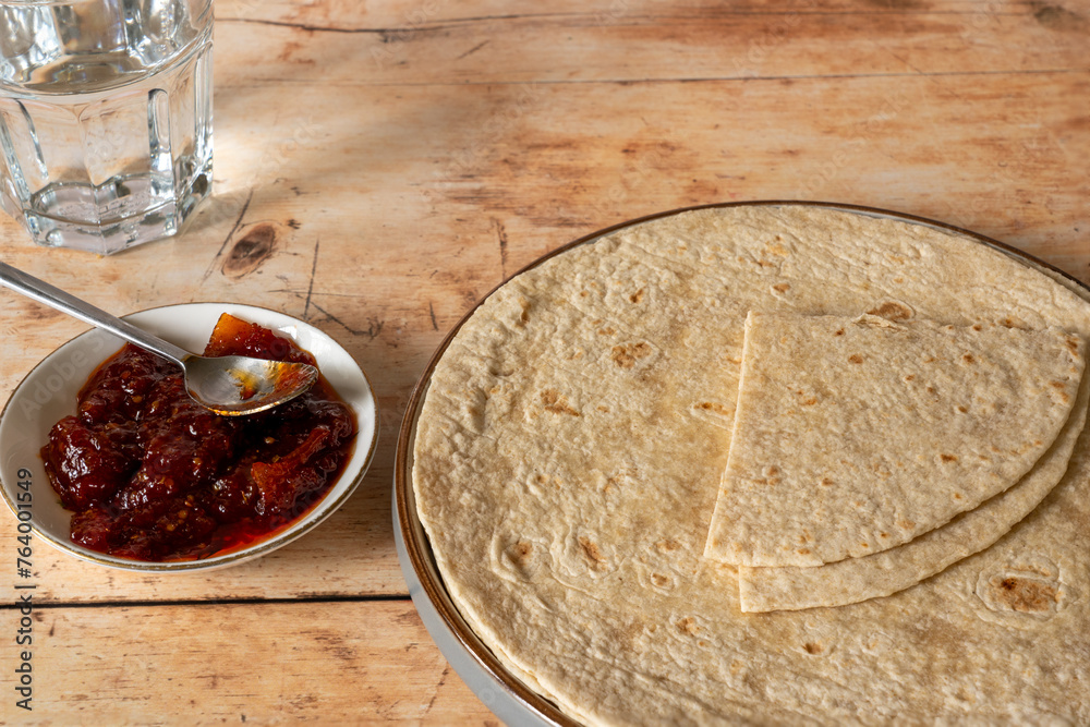Round Indian flat bread, roti or chapati, is an unleavened bread ...