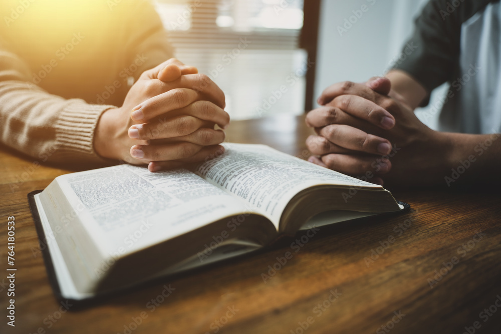 Christians and prayers Group of Christians holding hands praying for ...