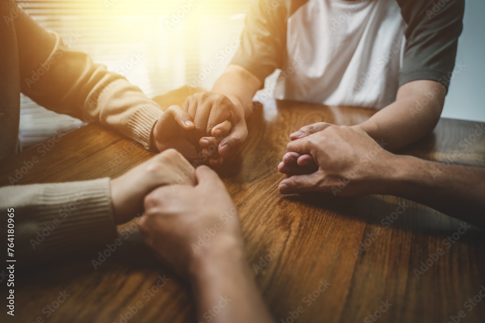 Christians and prayers Group of Christians holding hands praying for ...