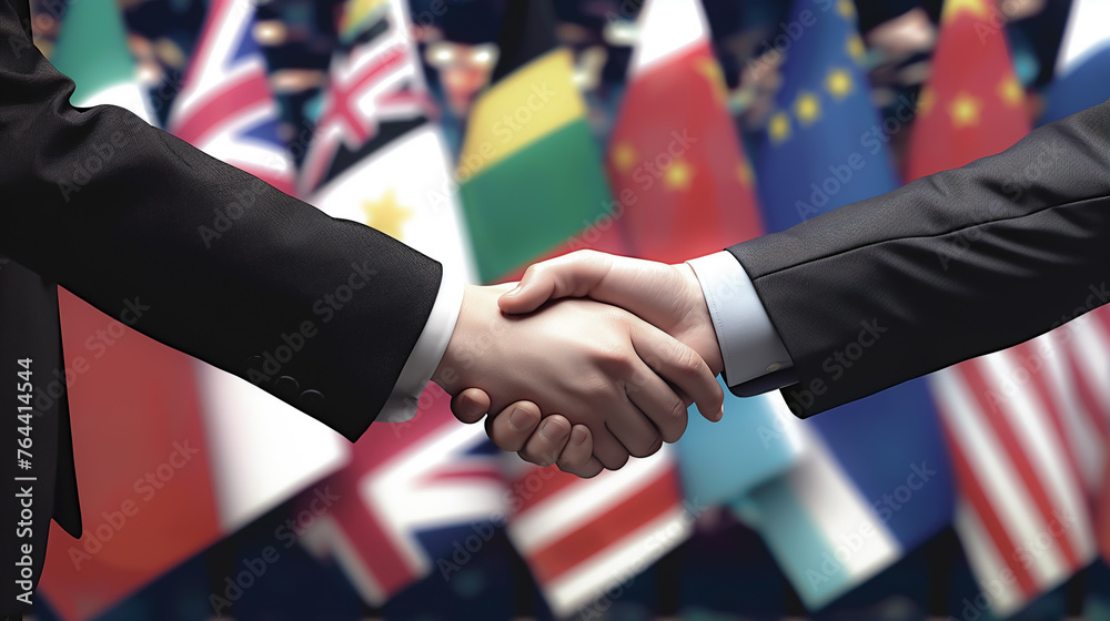 Two men shaking hands in front of flags of many countries, trade ...