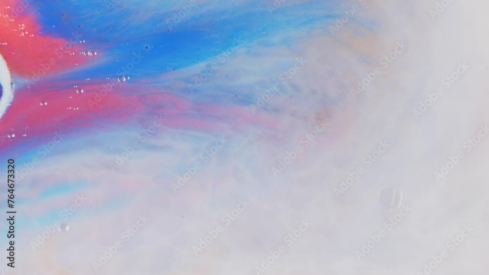 Vidéo Stock Swirling colors of ink diffusing in water, creating an ...