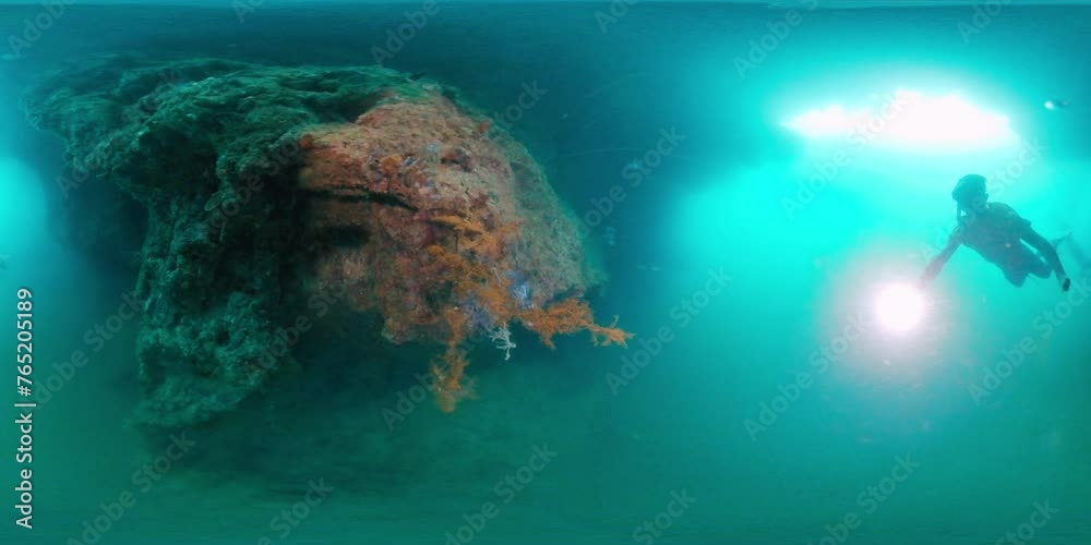 360 vr footage of the freediver. Man freediver swims underwater with ...