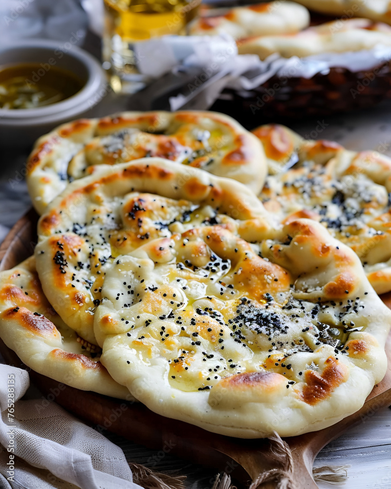 Manakish, A Middle Eastern flatbread made with a soft dough and topped ...