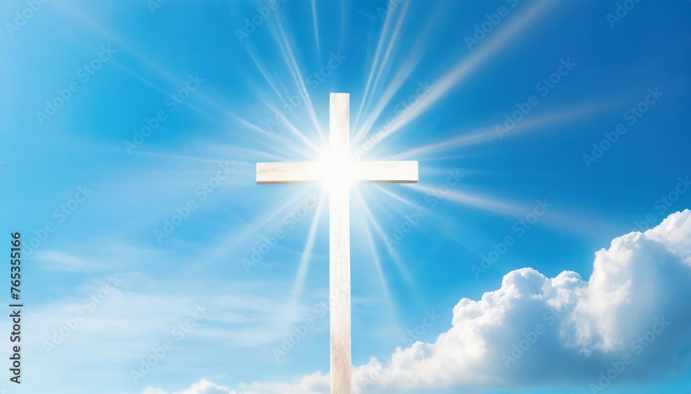 christian cross appears bright in blue sky background with sunny light ...