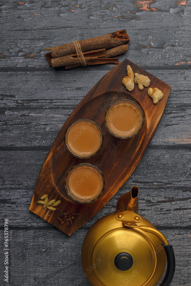 .Fresh milk masala tea or Indian Kadak Chai. Herbal tea in glass cups ...