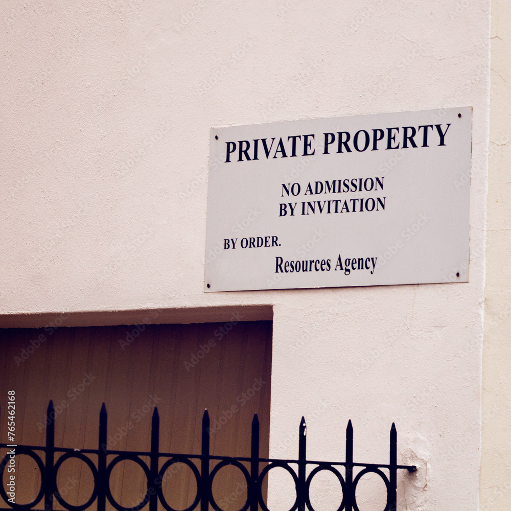 Warning, private property and sign for trespassing on wall for mistake ...