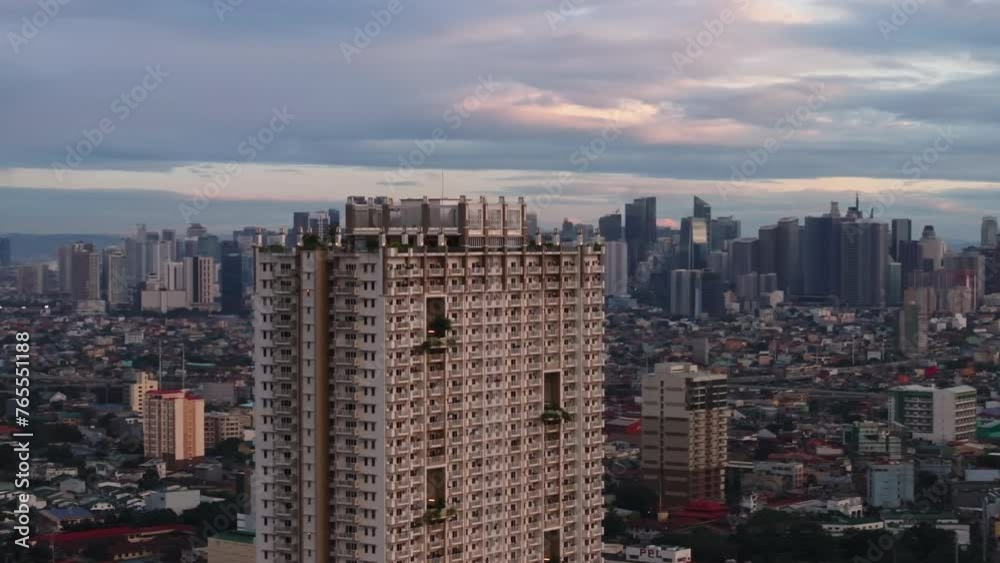 Fly around Torre de Manila building. Modern tall residential high rise ...