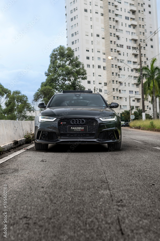 Black Audi RS6 Avant front view, cloudy sky, empty road - High ...