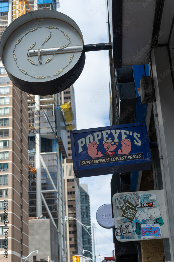 old projecting signs on Yonge Street in Toronto, Canada (including ...
