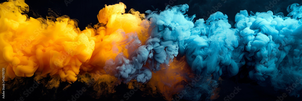 Colorful blue and yellow smoke merging and swirling while flowing on ...
