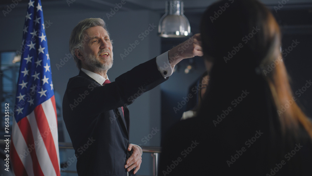 Positive American politician comes to journalists and poses for cameras ...