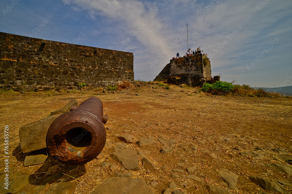 Old rusty cannon lying on the ground atop Fort Murud Janjira; an ...