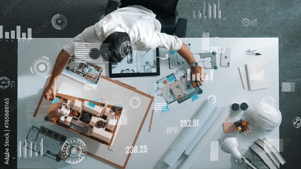 Top down view of civil engineer working on blueprint and inspect house ...