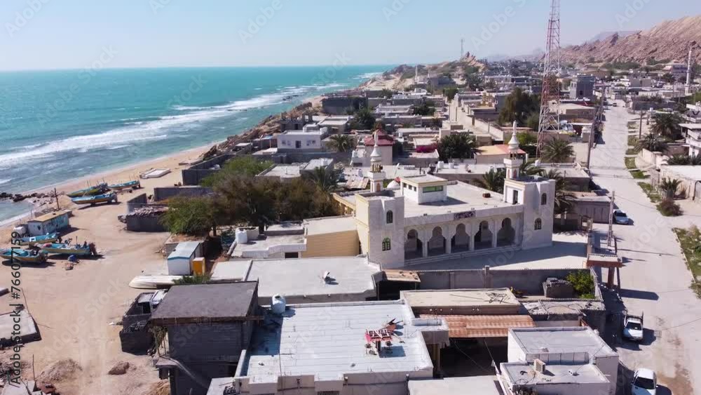 Seaside town white mosque minaret in urban village countryside in ...