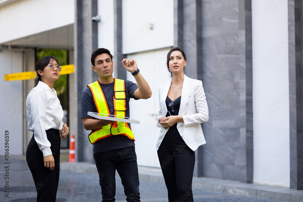 business woman and Office building owner and energy engineer plan a ...