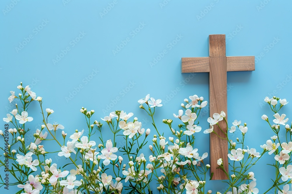 Religion background with a wooden cross and spring flowers against a ...