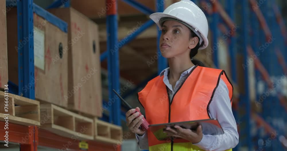 Female inventory staff wearing PPE are conducting a check in the high ...