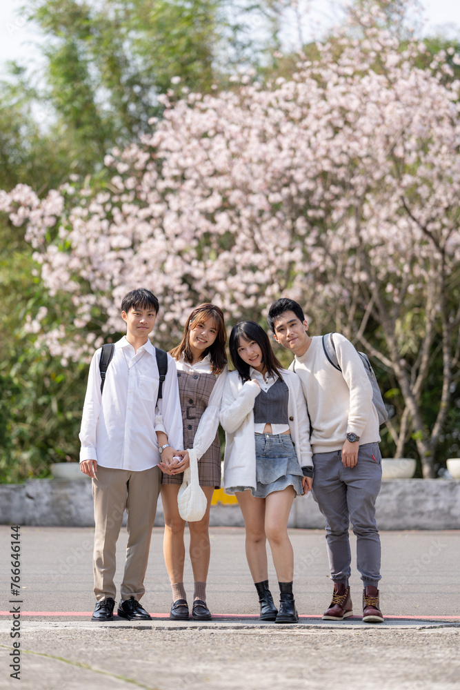 Four Taiwanese college students in their 20s are taking a commemorative ...