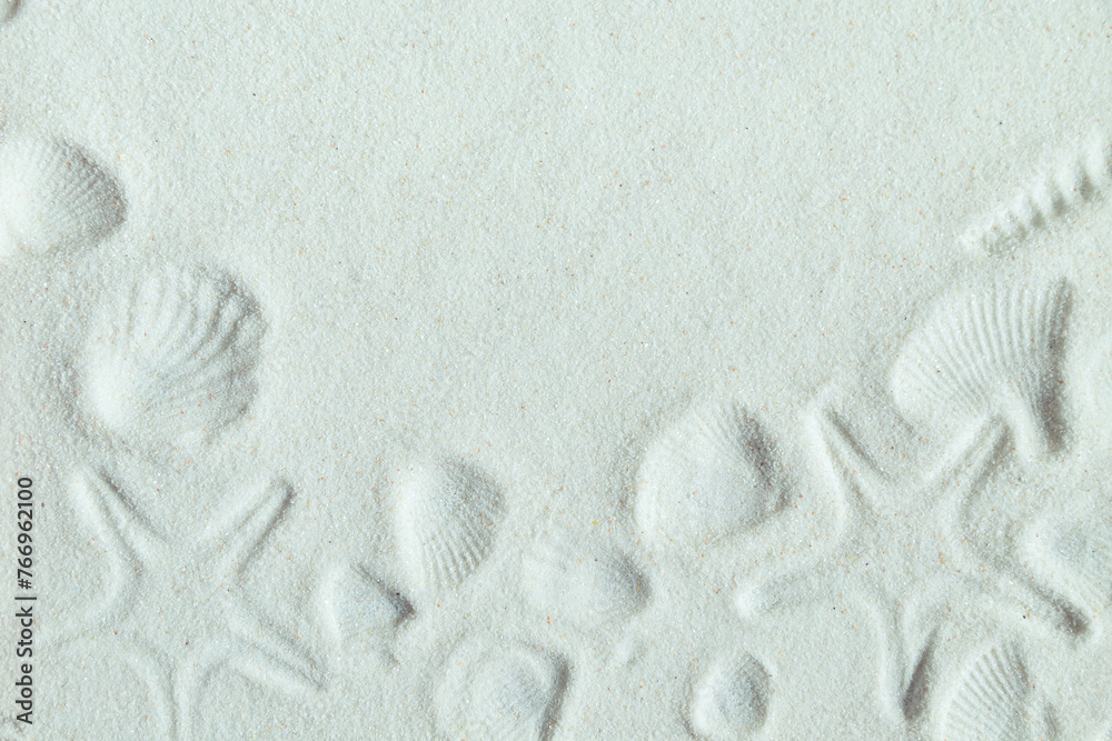 Sandy beach texture with imprints of shells and starfish. Stock Photo ...