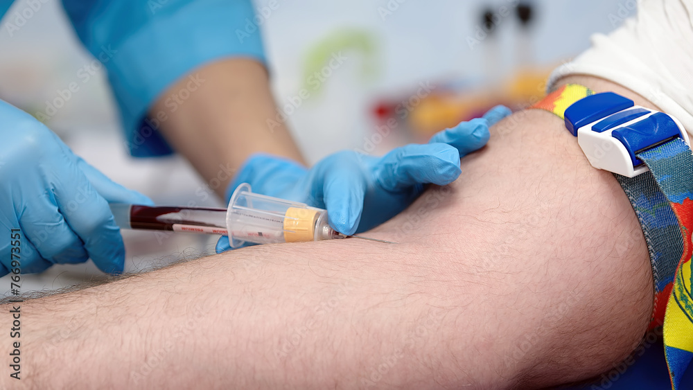A female doctor takes a plasma sample from a patient to treat patients ...