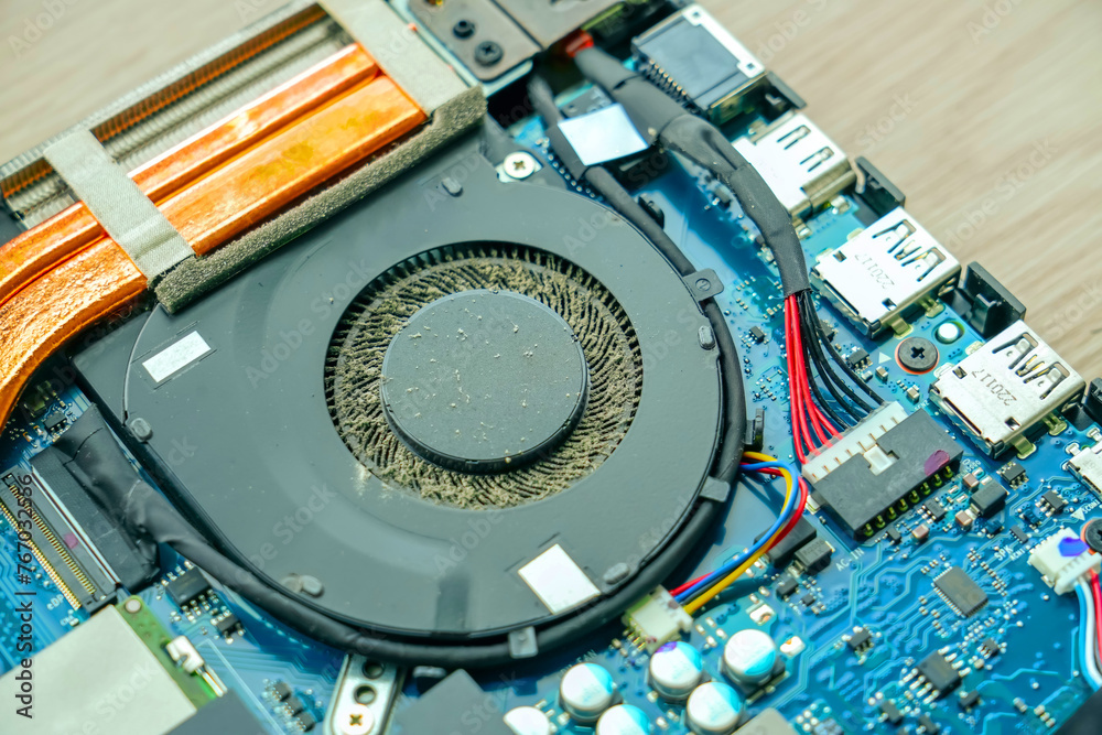 Close up old disassembled laptop after cleaning the cooler system ...