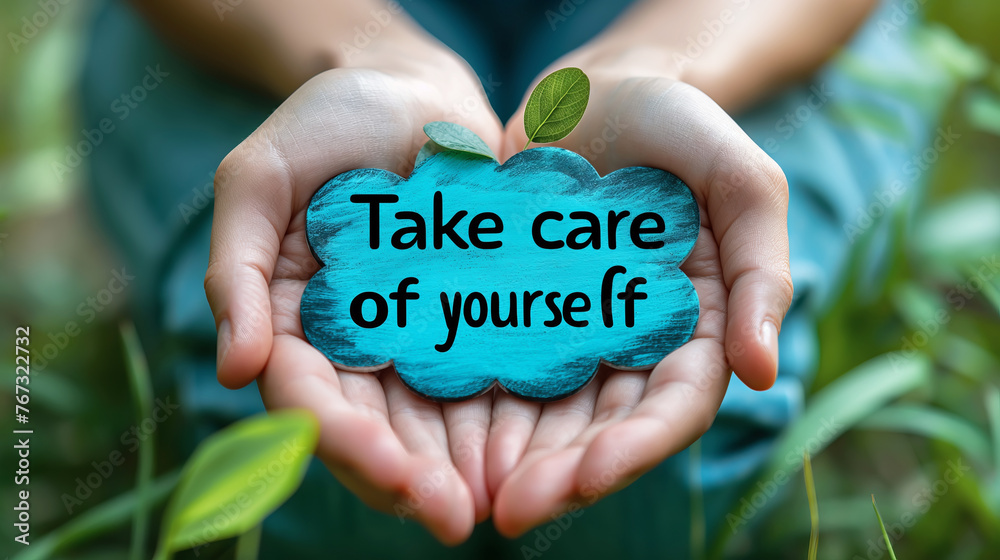 TAKE CARE OF YOURSELF sign in female hands among green plants. Self ...