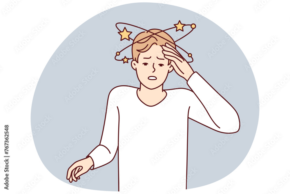 Suffering man experiencing pain in head after severe injury puts hand ...