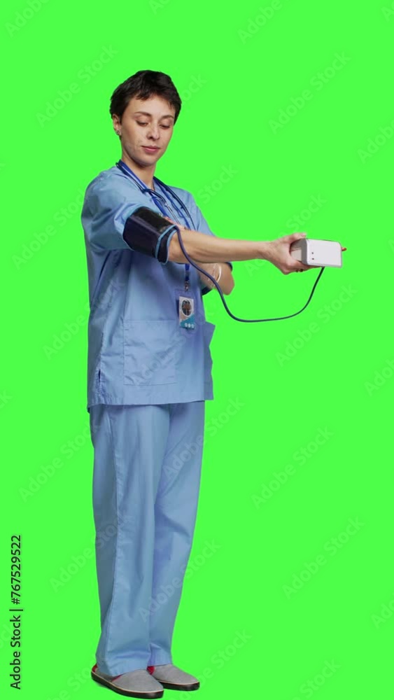 Side view Medical assistant showing tonometer used to measure arterial ...