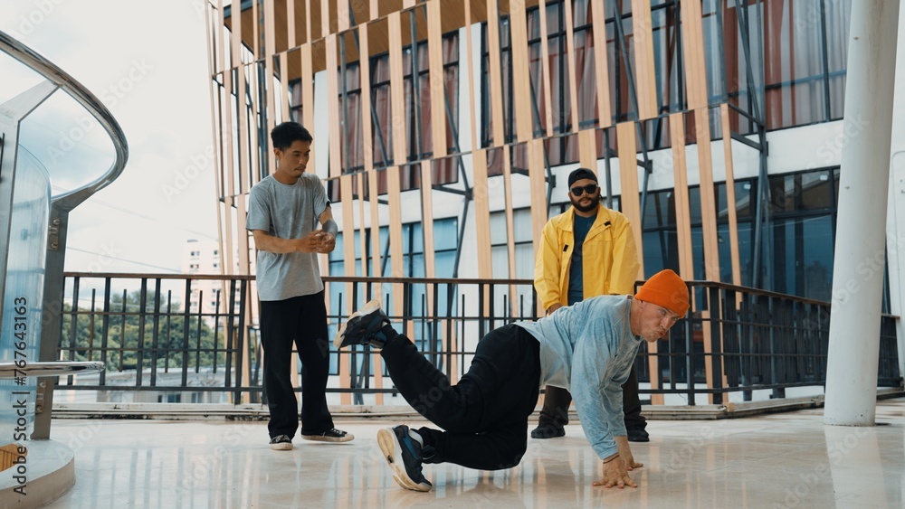 Hip hop team dance break dance while multicultural friend surrounded ...