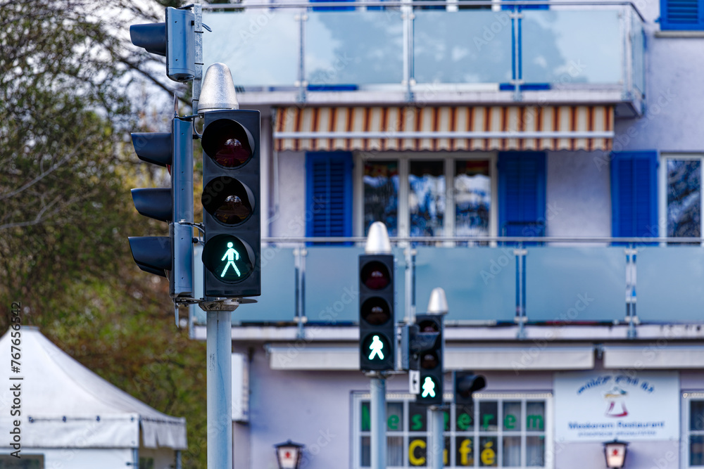 Green iight of pedestrian traffic light at zebra crossing at Swiss City ...