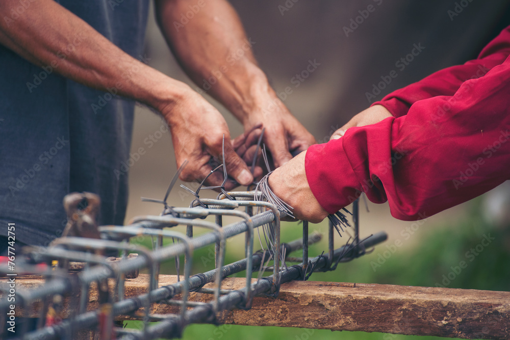 Construction Worker hands using pincer pliers iron wire. Outdoor Worker ...